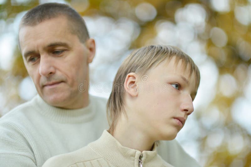 Sad father and boy stock photo. Image of autumn, father - 37111044