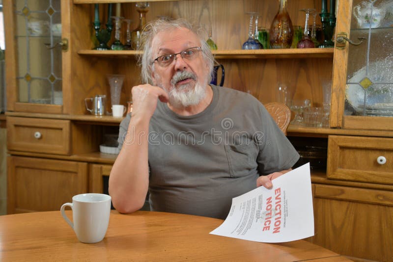Sad and Frustrated Old Man Reading Eviction Notice Stock Image - Image ...