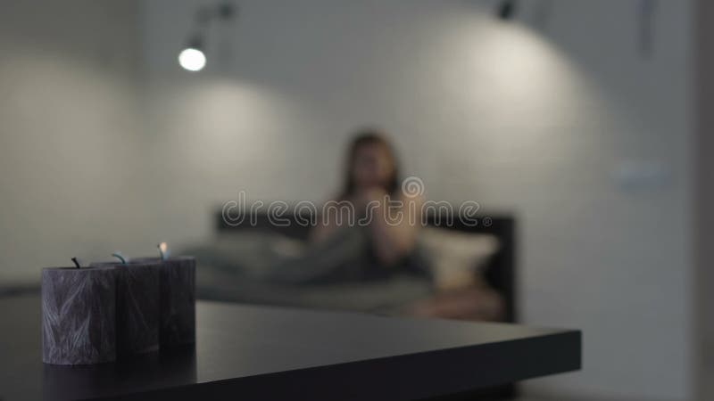 Sad Girl on the Bed by Candlelight Stock Video - Video of home, evening ...