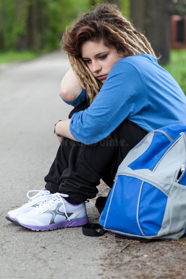 Sad Girl with Dreadlocks Sitting on Road Stock Photo - Image of student ...