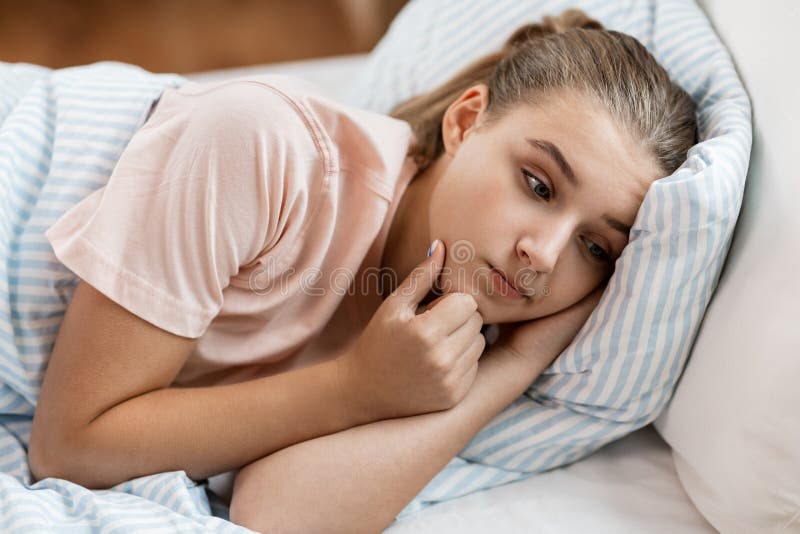 Sad Girl Lying in Bed at Home Stock Photo - Image of lifestyle, duvet ...