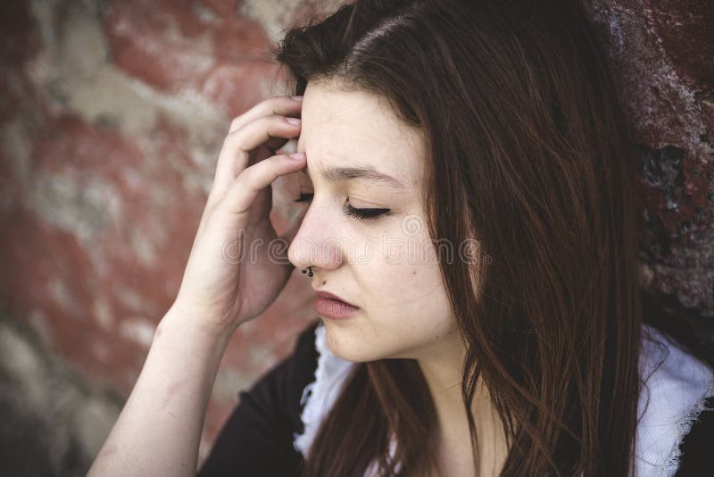 Sad Girl Sitting Against Brick Wall Stock Photos - Download 90 Royalty ...
