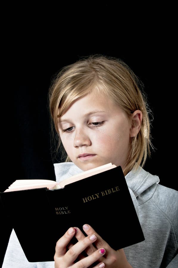 Sad girl reading the bible stock photo. Image of girl - 26579164