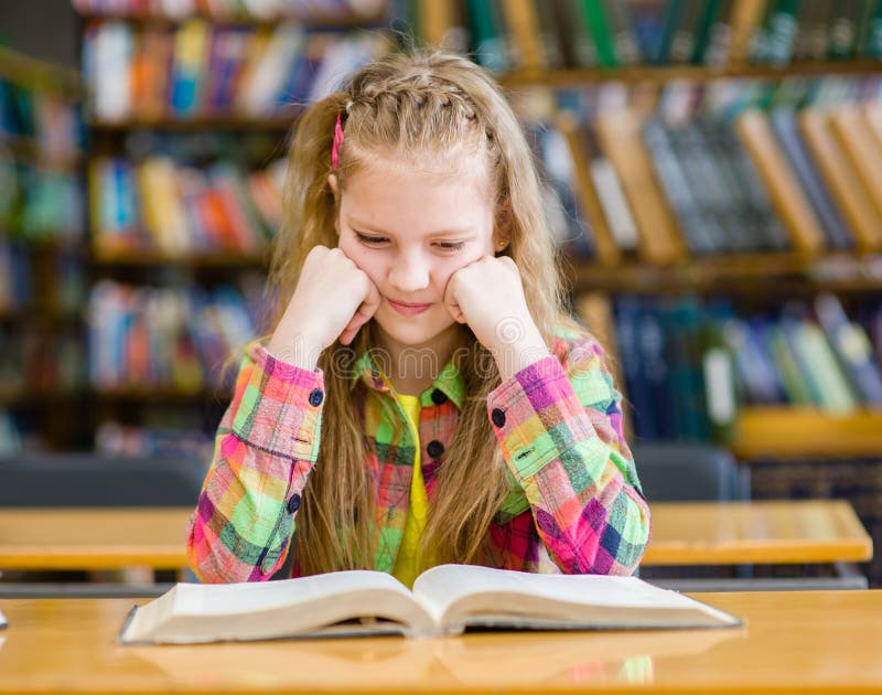 Girl Reading a Book at the Library Stock Image - Image of caucasian ...