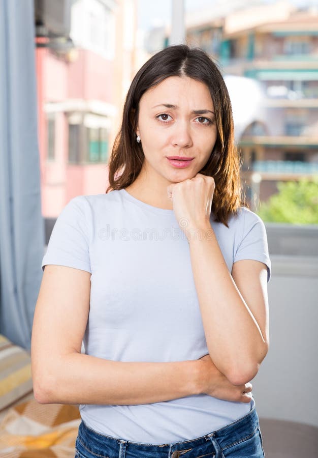Sad Girl is Standing in Home Interior, Thinking about Troubles Stock ...