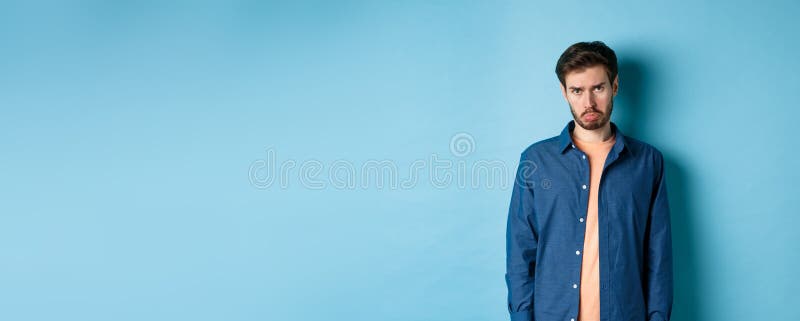 Sad and Gloomy Young Man Sulking, Pulling Miserable Face and Looking ...