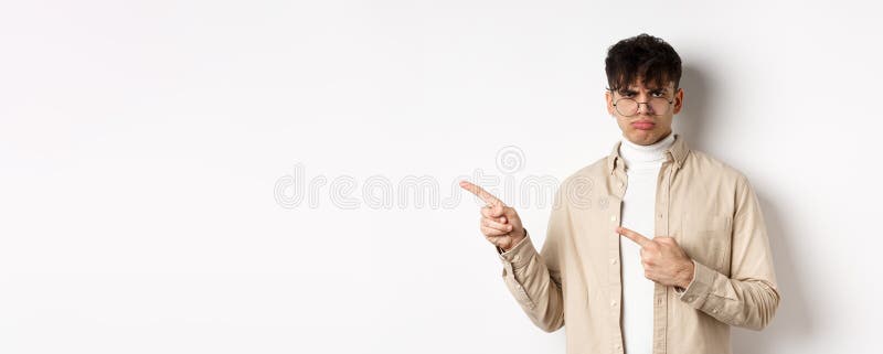 Sad and Grumpy Boy Pointing Fingers Left, Sulking with Childish ...