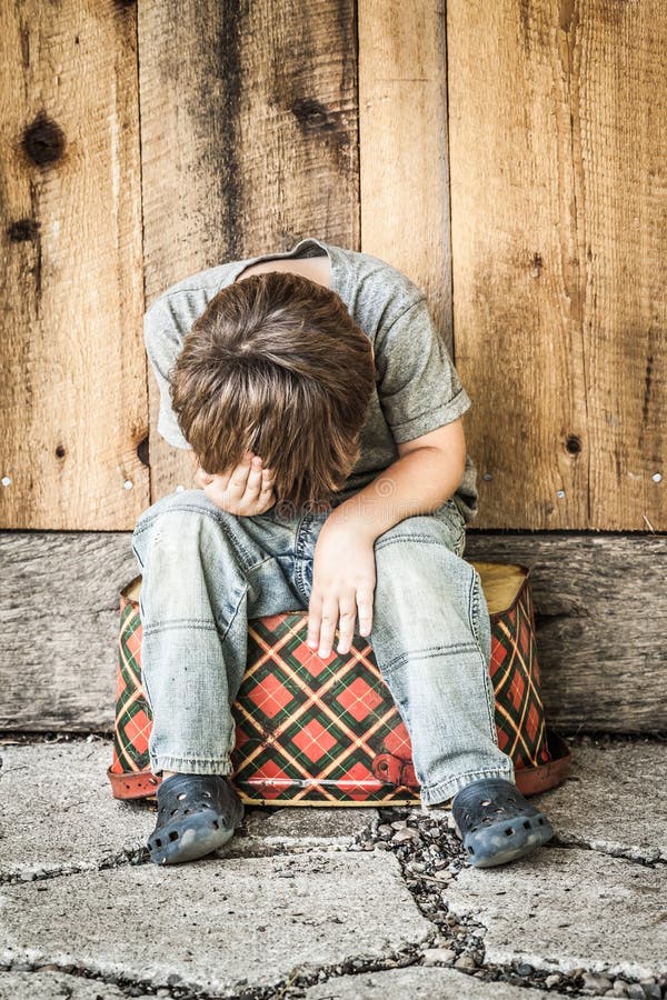 Sad Homeless Boy stock photo. Image of hunger, eyes - 145573304
