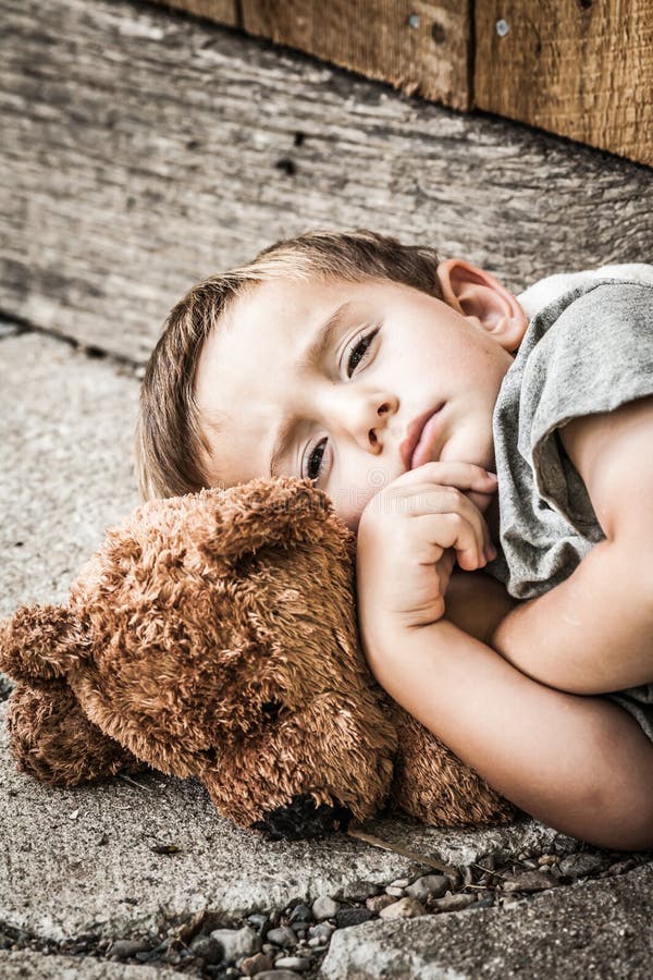 Sad Homeless Boy stock photo. Image of sadness, poor - 145574124