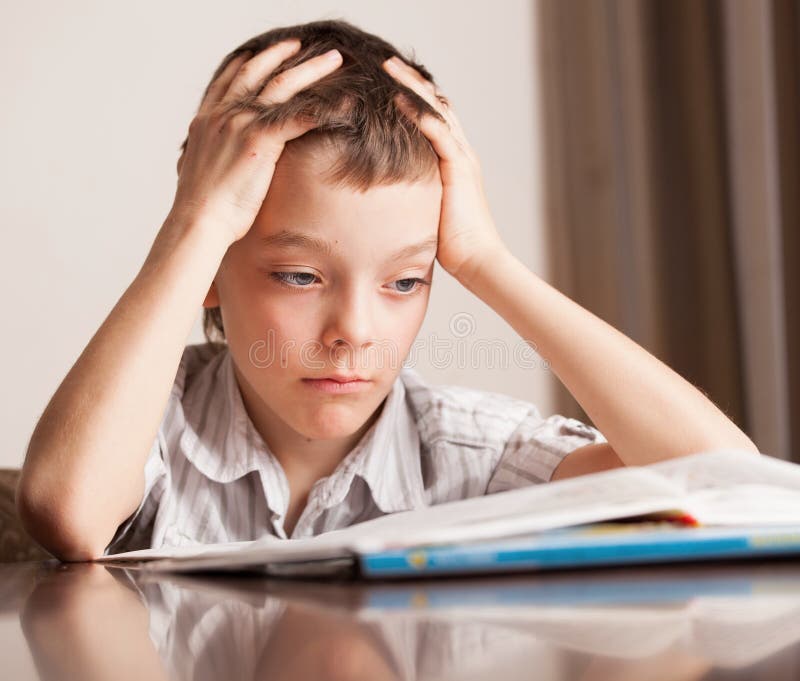 Sad kid doing homework stock image. Image of paper, girl - 34383025