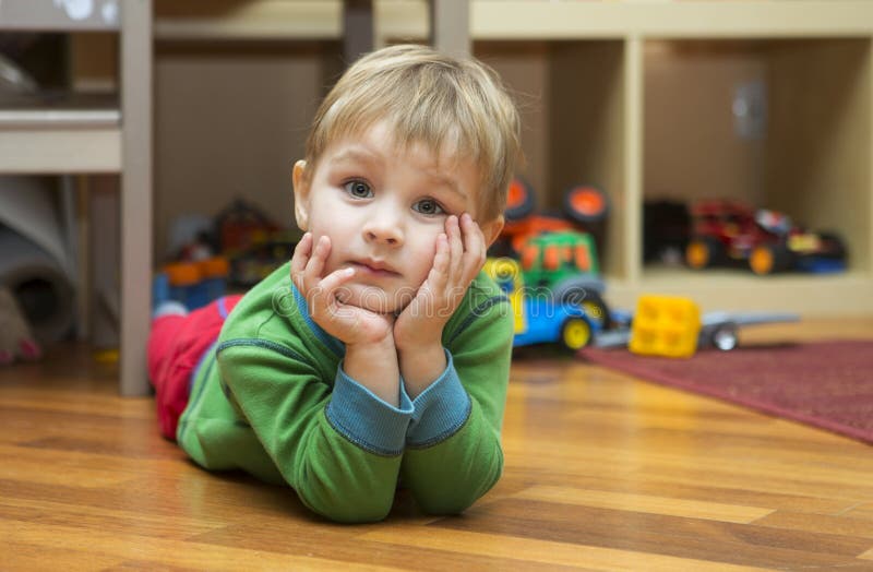 Sad kid stock photo. Image of care, cute, indoors, headache - 66043396