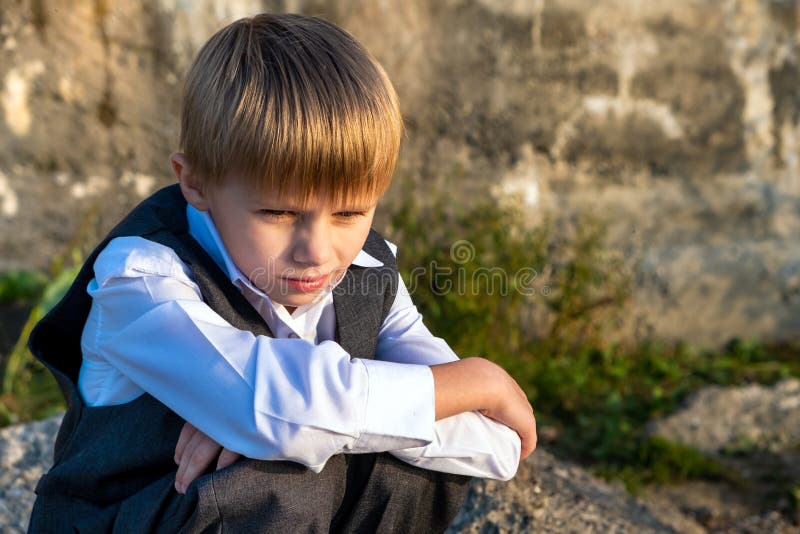Sad Boy outdoor stock photo. Image of sadness, grass - 111842244