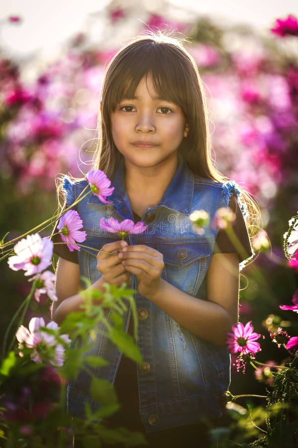 Sad little asian girl stock image. Image of cosmos, flower - 44991847