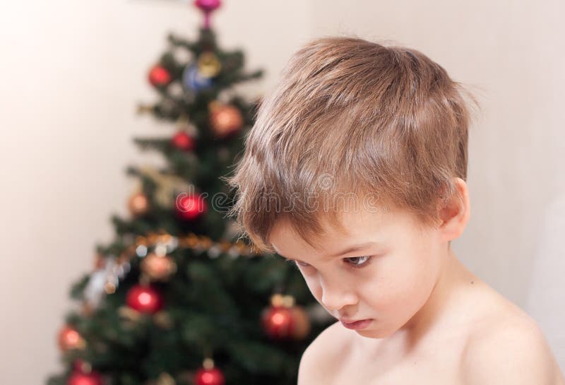 Sad Little Boy about the Christmas Tree. Stock Photo - Image of tree ...