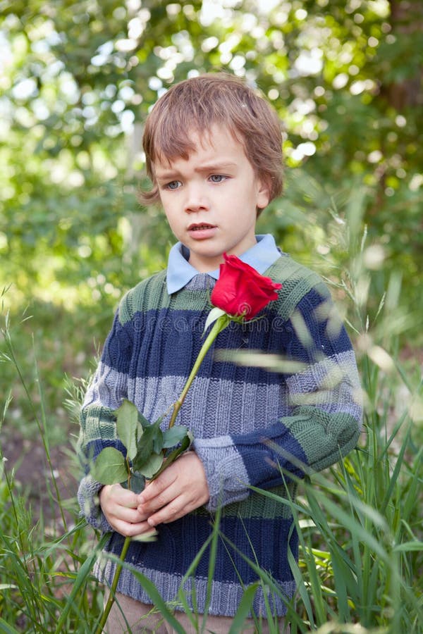 Sad Little Boy Holding Red Rose in Her Hand, Park Stock Photo - Image ...
