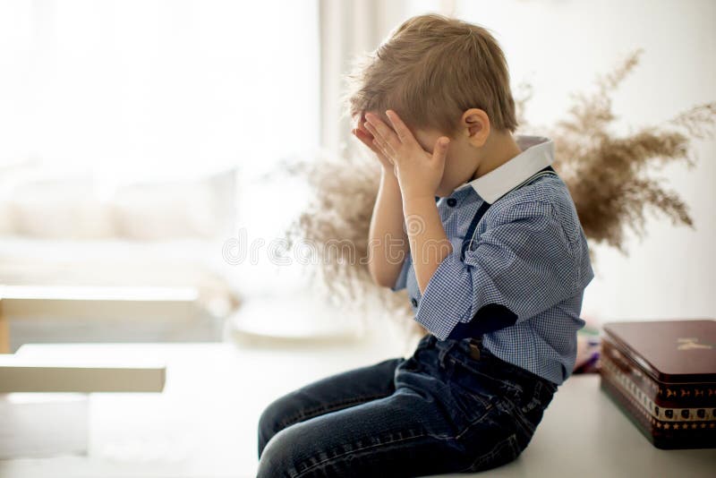 Sad Little Child, Hurt, Sitting at Home, Crying Stock Photo - Image of ...