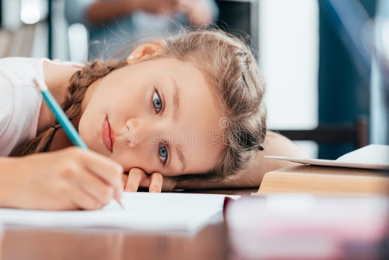 Sad little girl writing stock image. Image of learning - 118809913
