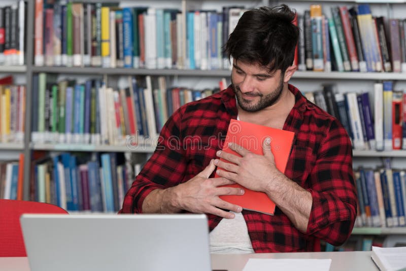 Sad Male Student in the University Library Stock Photo - Image of stack ...