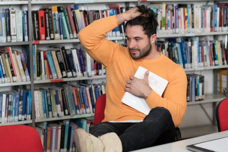 Sad Male Student in the University Library Stock Image - Image of male ...