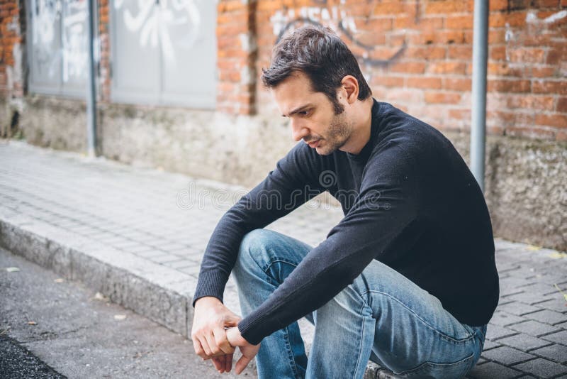 Sad man alone in the city stock photo. Image of caucasian - 77517000