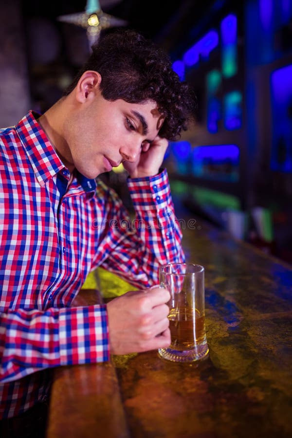 Sad man at bar counter stock image. Image of clubbing - 77710475