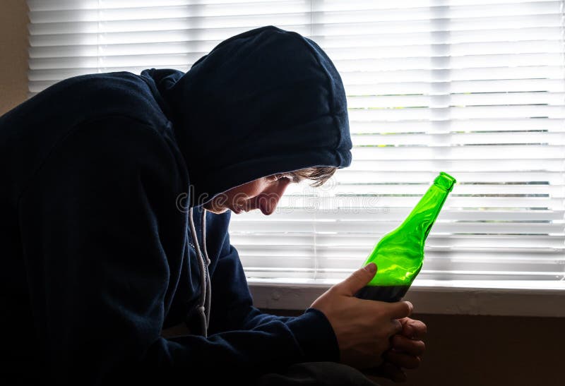 Sad Man with a Beer stock photo. Image of jalousie, room - 262737770