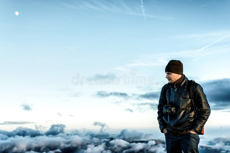 Sad Man with Camera on Peak Looking Down Stock Photo - Image of ...