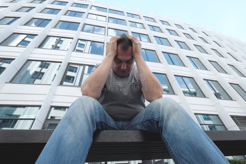 Sad Man Sitting Front Office Building Stock Photos - Free & Royalty ...
