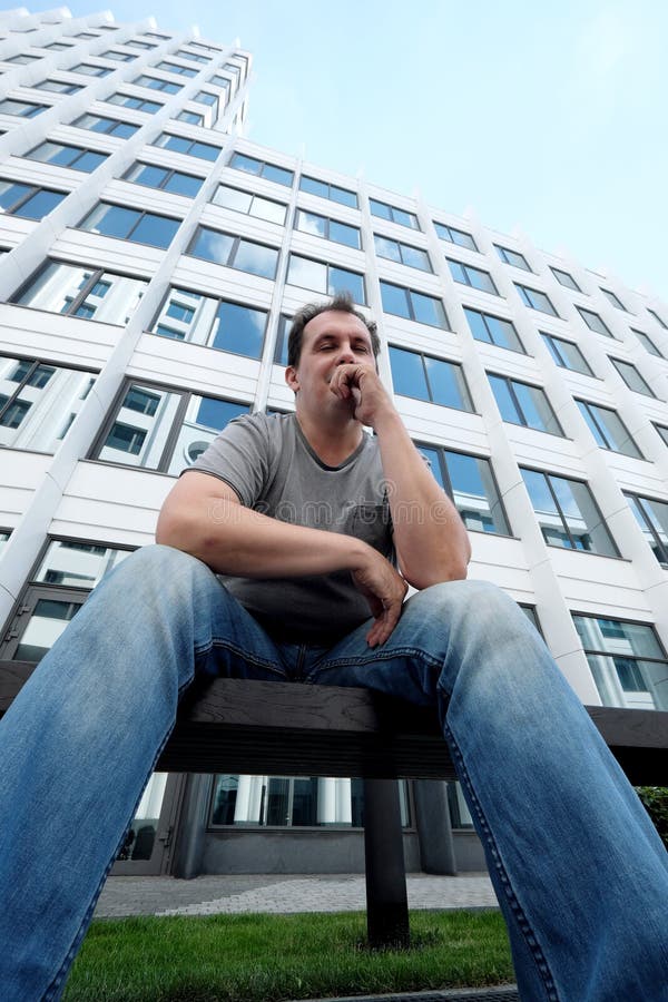 Sad Man Sitting Front Office Building Stock Photos - Free & Royalty ...