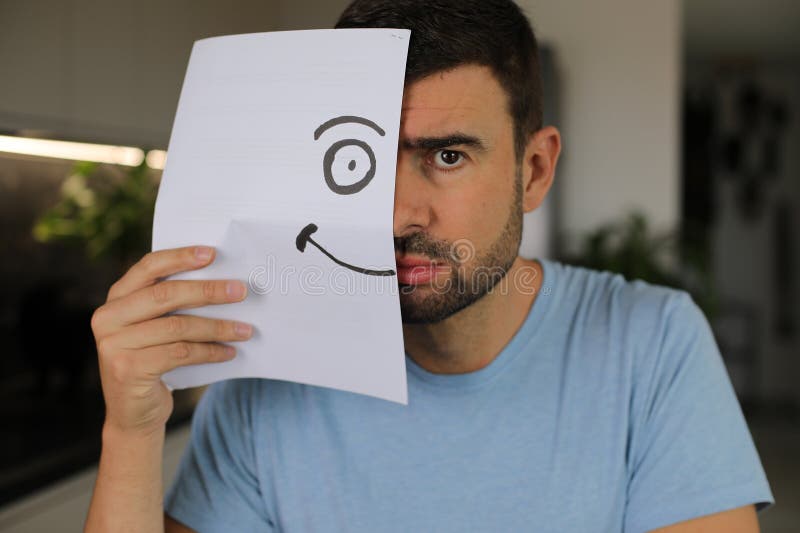 Sad man with a happy mask stock image. Image of male - 344671215