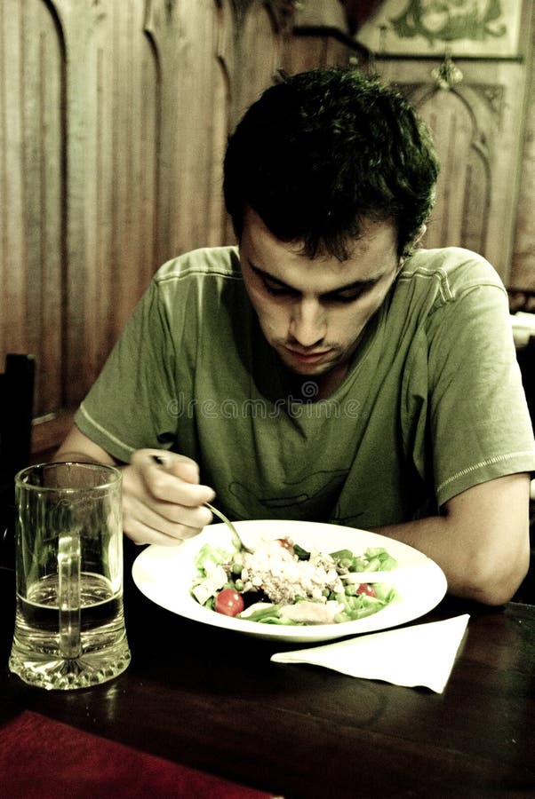 Sad man having a meal stock photo. Image of downhearted - 3196230