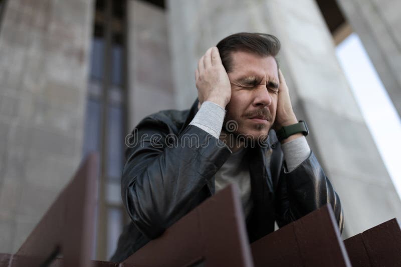 Sad Man Holding His Head and Worrying Stock Image - Image of wall ...