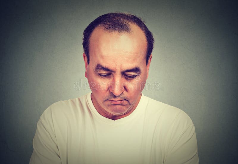 Sad man looking down stock photo. Image of gloomy, sadness - 71034834