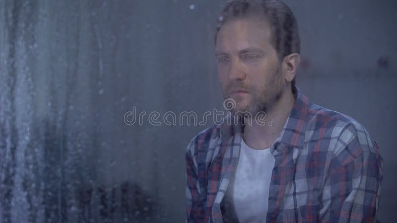 Sad Man Looking through Window during Rainy Weather, Thinking about ...