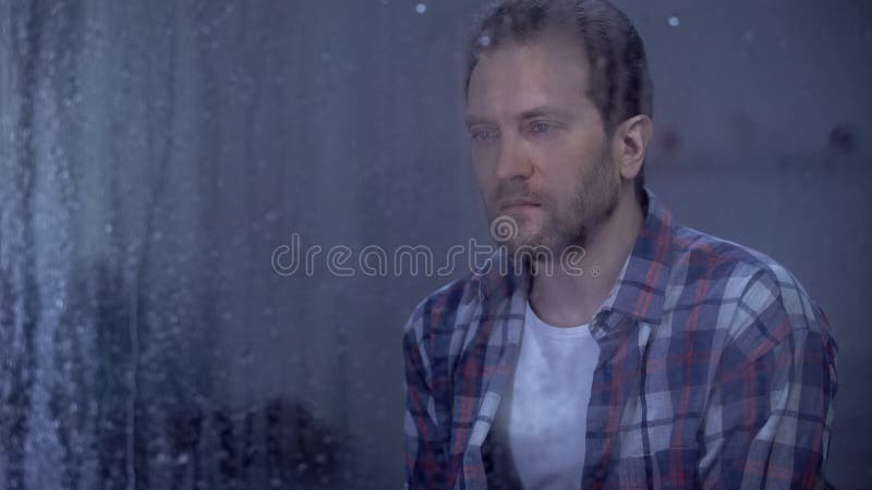 Sad Man Looking through Window during Rainy Weather, Thinking about ...