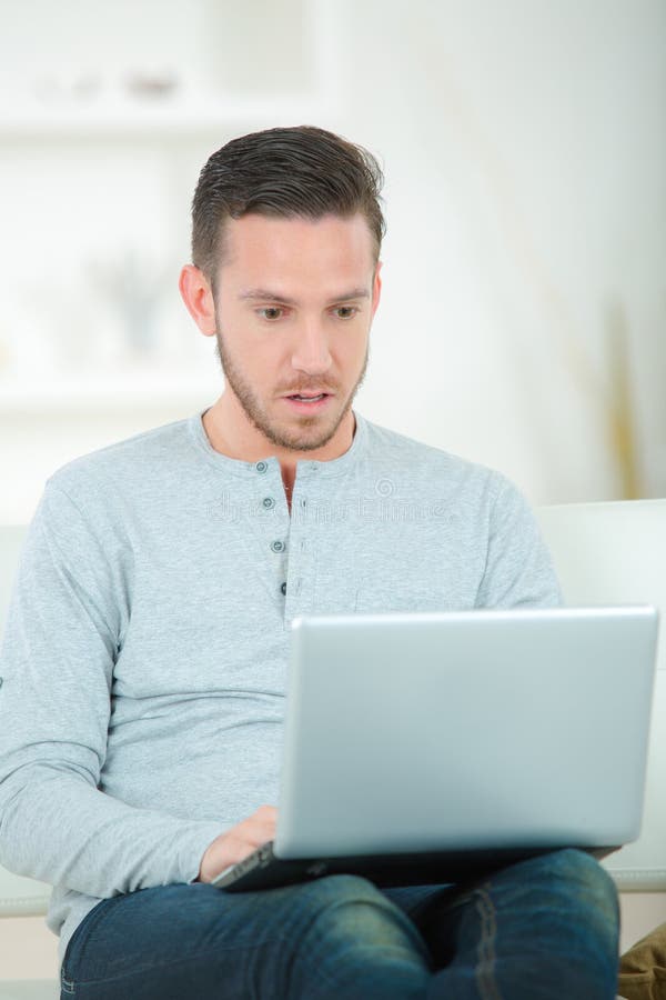 Sad man near laptop stock photo. Image of emotional - 197681000