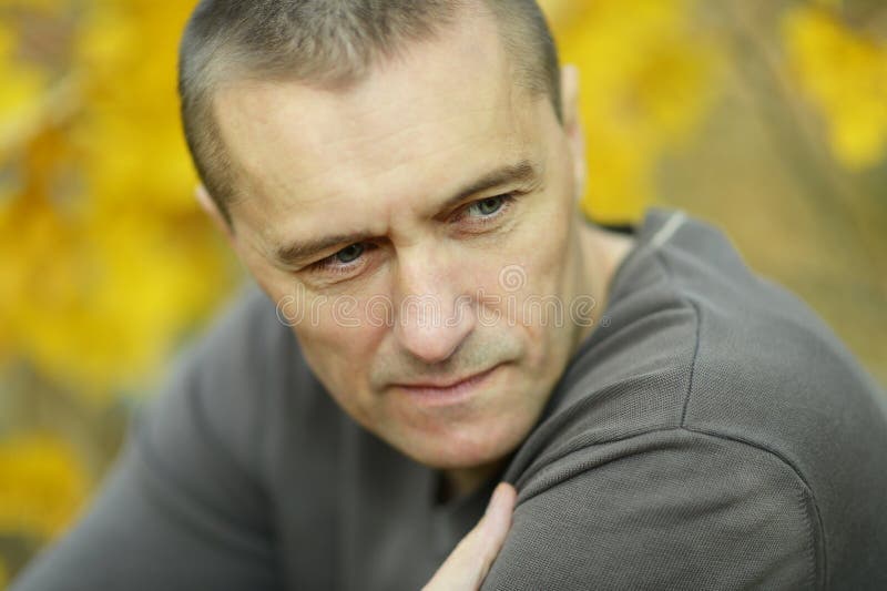 Sad man out for a walk stock image. Image of attractive - 68311349