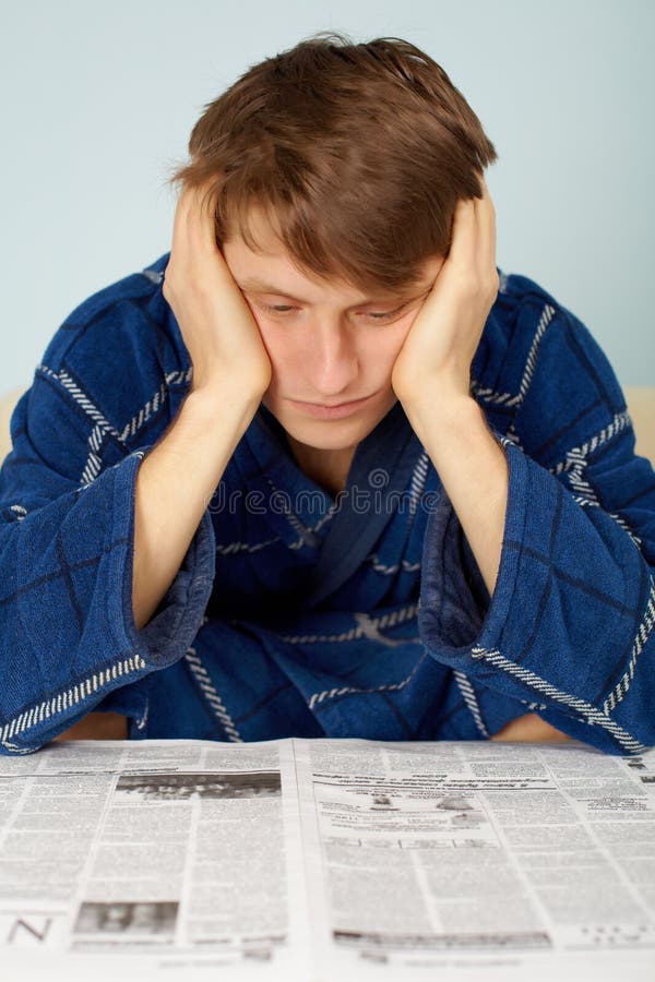 Sad Man Reading a Newspaper Stock Image - Image of news, doleful: 18662715