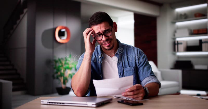 Sad Man Reading Paper Invoice Stock Photo - Image of invoice ...