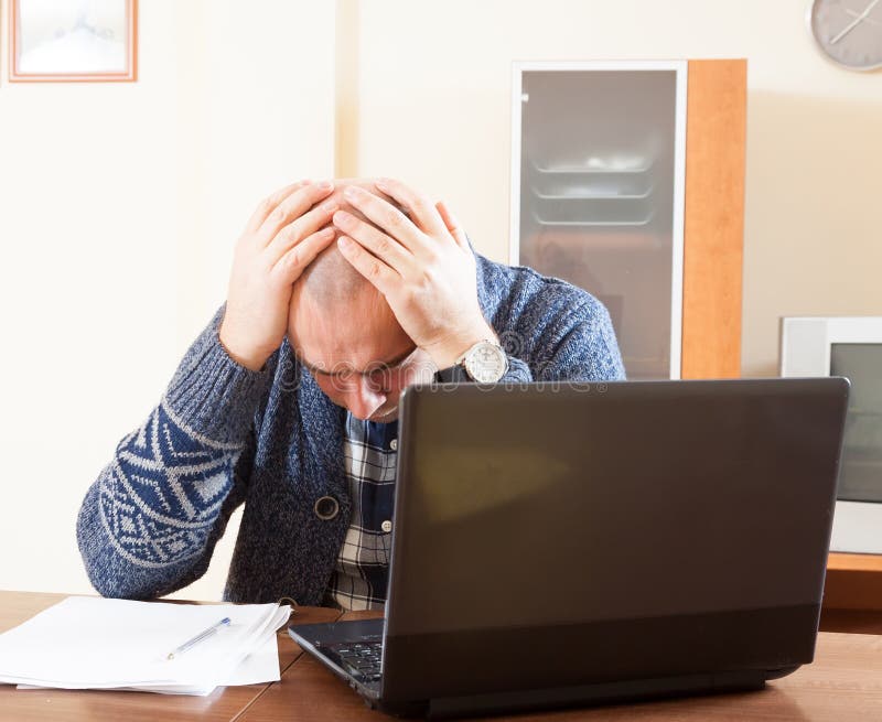 Sad man sitting at work stock image. Image of internet - 38280129