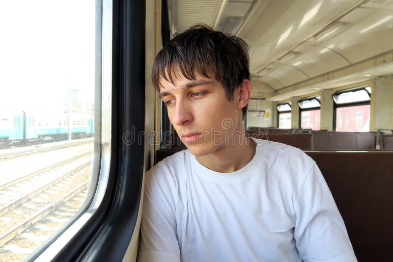 Sad Young Man in the Train stock photo. Image of despondent - 86360374