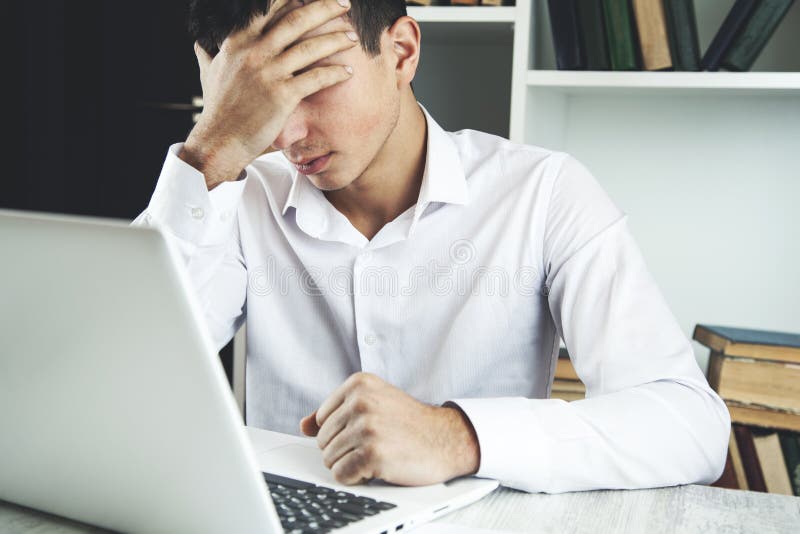 Sad man in office stock image. Image of unhappy, problem - 136485245