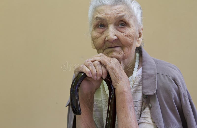 Sad Old Lady Contemplating with Walking Stick Stock Photo - Image of ...