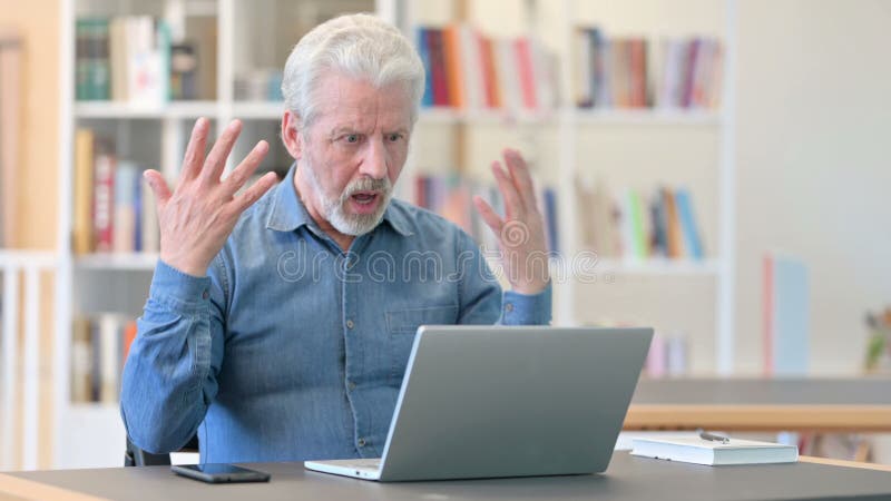 Sad Senior Old Man Having Failure on Laptop in Library Stock Footage ...