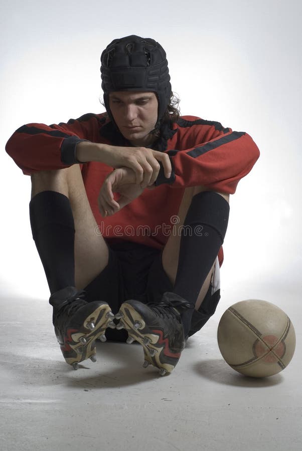 Sad Rugby Player - Vertical Stock Image - Image of indoors, unhappy ...