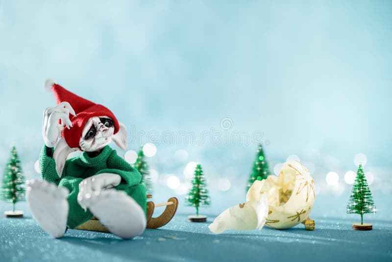 Sad Santas Helper Elf Sitting on Sledge Looking at Broken Christmas ...