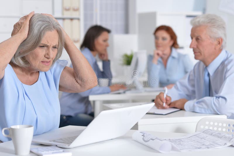 Sad Senior Business Woman Working in Light Office Stock Photo - Image ...