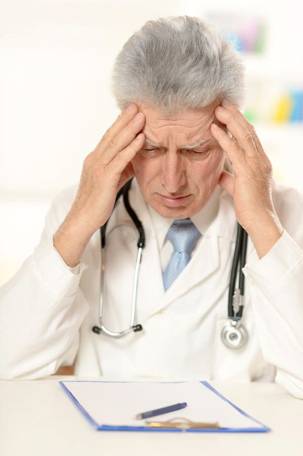 Sad senior doctor stock image. Image of documents, portrait - 42453525