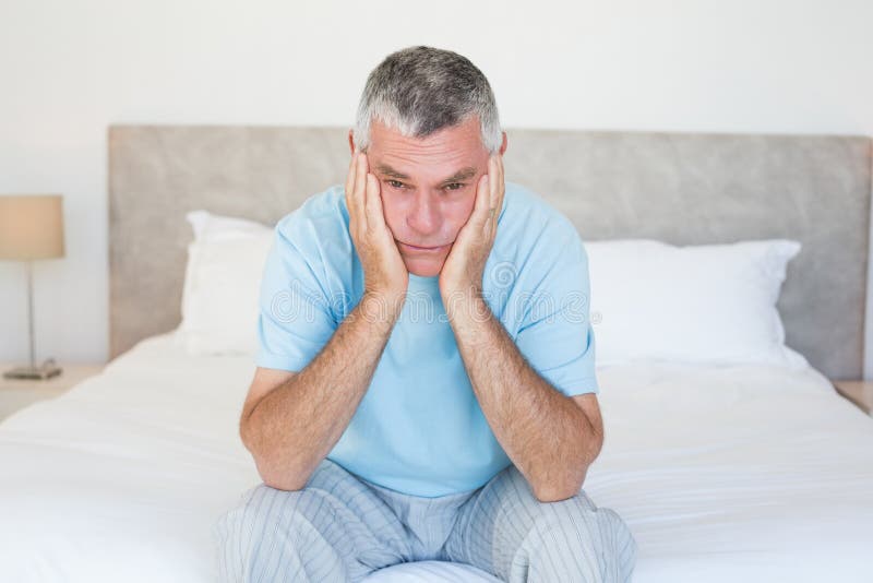 Sad Senior Man Sitting on Bed Stock Photo - Image of hands, indoors ...