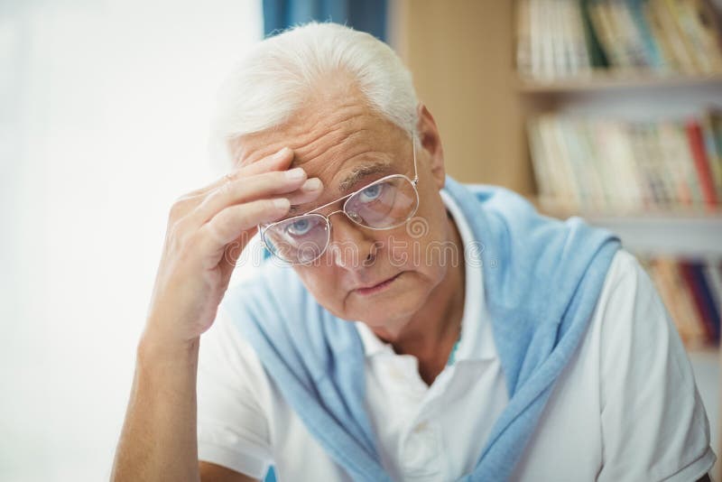 Sad Senior Man Sitting at Table Stock Photo - Image of books, home ...